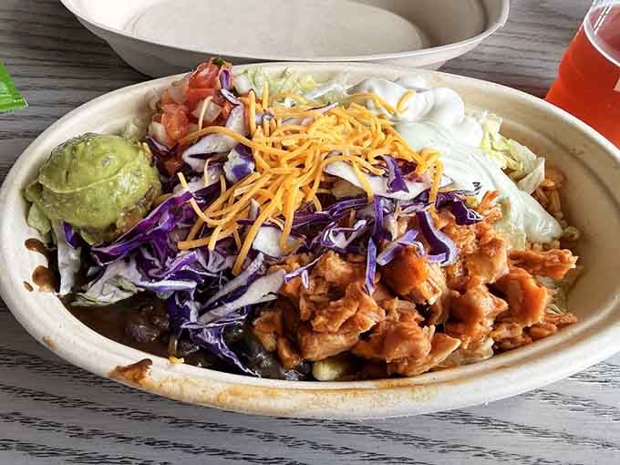 The Cantina Chicken Bowl arrives loaded with chicken, black beans, purple cabbage, guacamole, and enough toppings to make you reconsider your lunch plans.