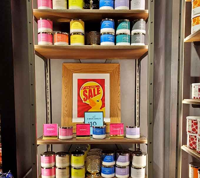 Bath and Body Works candles stacked in every color, making the whole store smell like a very good decision.