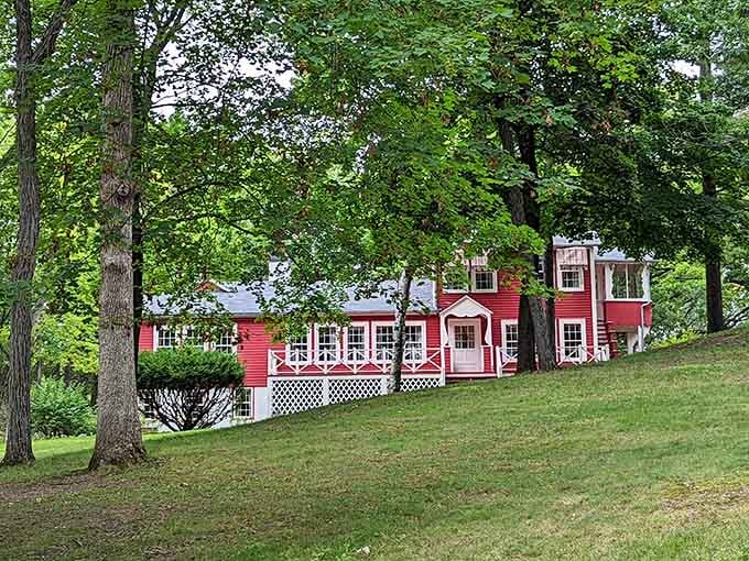 That bold red building peeking through the trees is the kind of surprise that makes you stop walking.