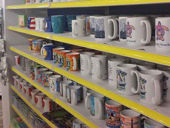 Crystal Beach coffee mugs lined up like cheerful little ambassadors. Your morning coffee deserves a souvenir vessel this good.