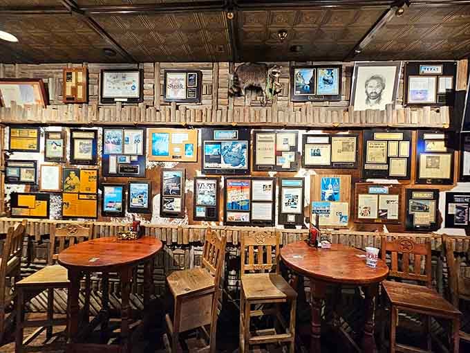 Framed clippings, mounted memories, and decades of stories covering every inch of that wall.
