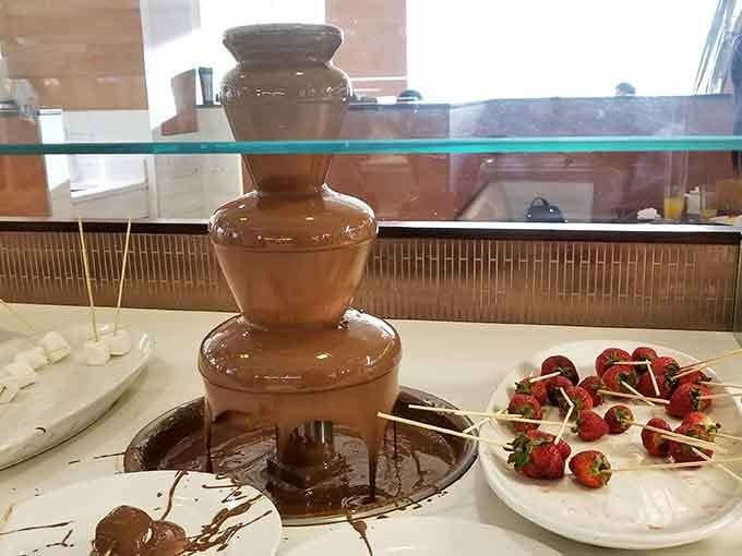 A chocolate fountain surrounded by strawberries and marshmallows. Some things in life are simply non-negotiable.