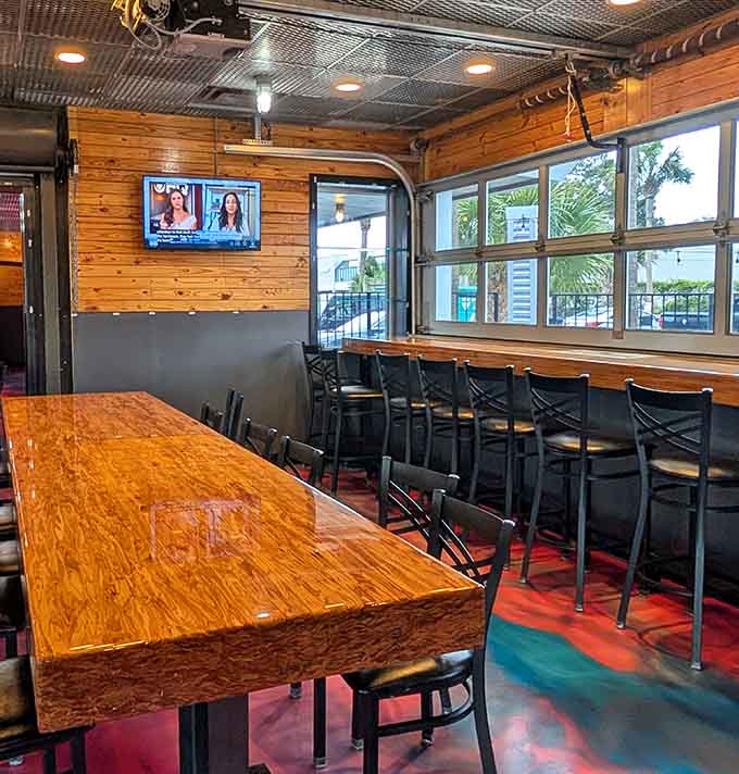 Bar-height seating, warm wood tones, and garage-style windows that let the North Myrtle Beach sunshine right in.