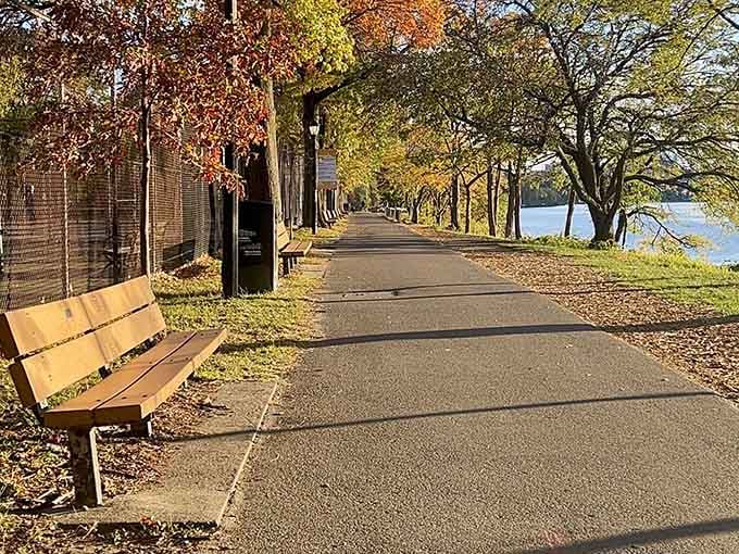 Fort Washington Park's tree-lined path in autumn is the kind of walk that makes you forget you're in Manhattan.