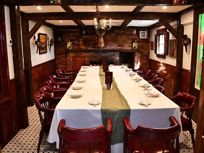 Dark beams, a roaring fireplace, and a mounted stag overhead. This private dining room means business, colonial-style.