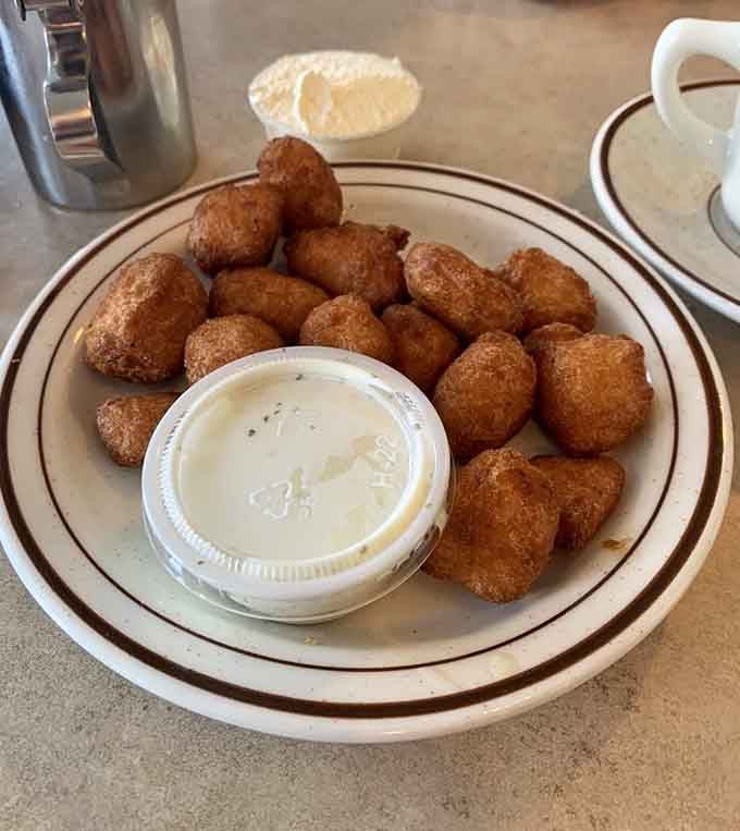 Wisconsin cheese curds, fried to crispy perfection, with dipping sauce ready. This is local pride on a plate.