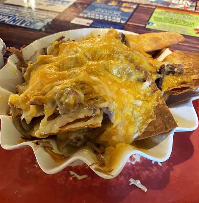 Bubba's Brisket Nachos, where smoked brisket meets melted cheese in a combination that should honestly be studied by scientists.