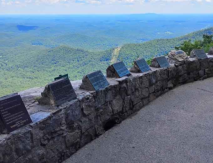 These plaques along the stone wall hold words worth reading slowly, with the whole Blue Ridge spread out before you.