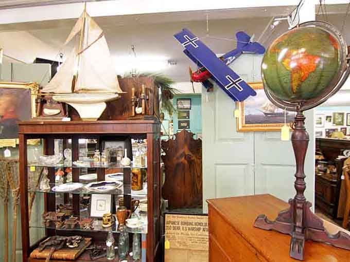 A vintage globe, a model sailboat, and a toy biplane walk into a thrift store. No punchline needed.