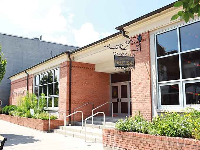The Tipp City Public Library, tucked behind cheerful flower beds, looking like the kind of place where great afternoons quietly begin.