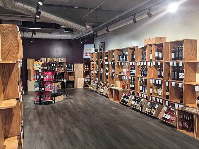 Rows of wooden wine crates stacked floor to ceiling at City Vino create a warm, inviting space that practically selects your bottle for you.