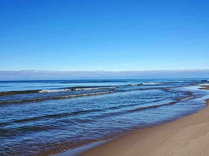 Lake Michigan doing its best ocean impression, complete with waves that stretch to a horizon you can't see.