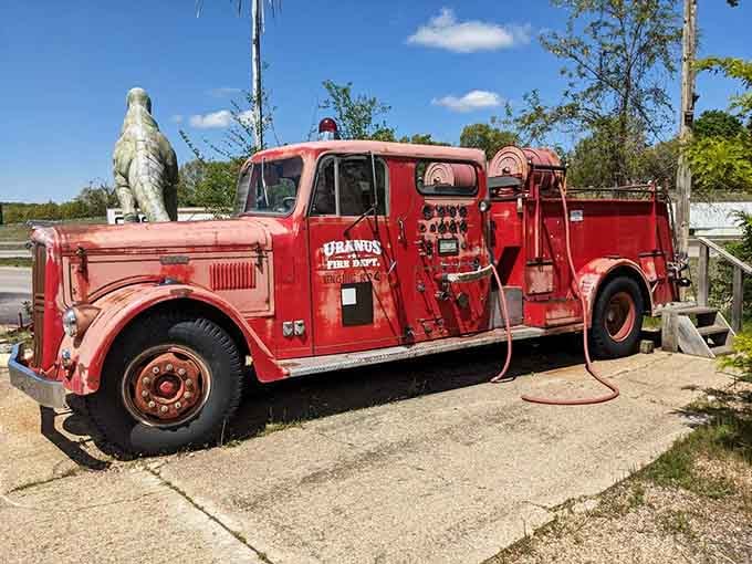 The Uranus Fire Department truck sits proudly outside, vintage and bold, ready to protect the whole operation.