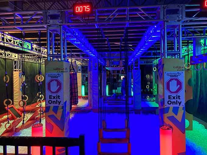 That countdown clock isn't decorative. The obstacle course here means serious business under cool blue lights.