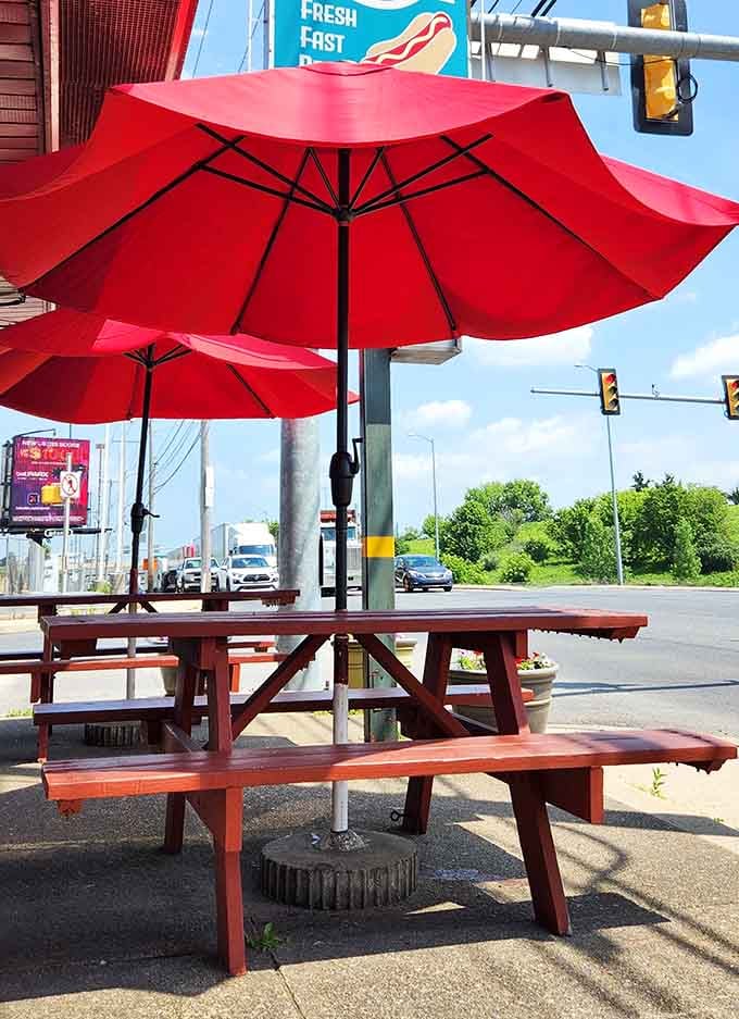 Red picnic tables under big red umbrellas on a sunny day. Life's simple pleasures, right here in Hellertown.