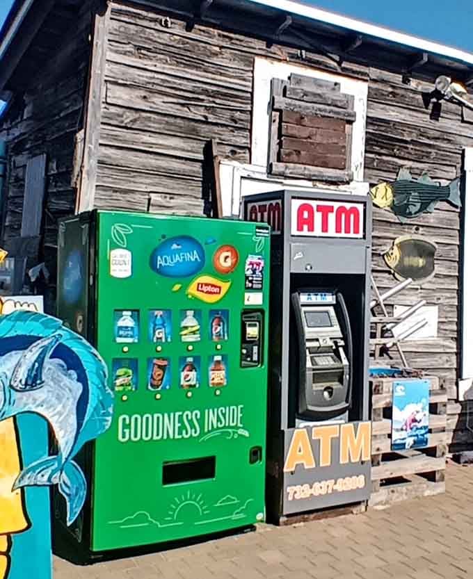 Even vending machines and ATMs get the rustic treatment here, because consistency matters at a fishing village.