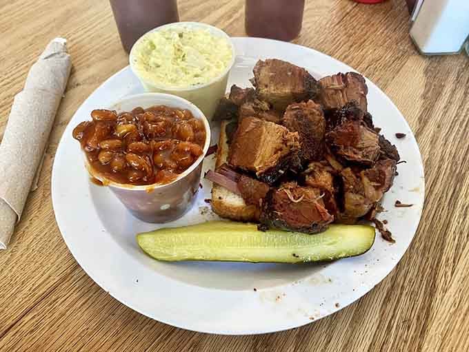 Burnt ends, BBQ beans, creamy slaw, and a pickle. This plate is a complete sentence, and it ends with an exclamation point.