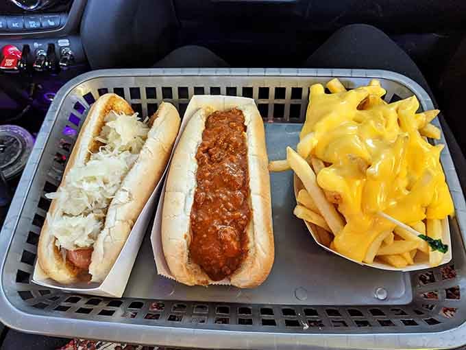 Two loaded franks and a mountain of cheese fries on a tray is a drive-in dream come true.