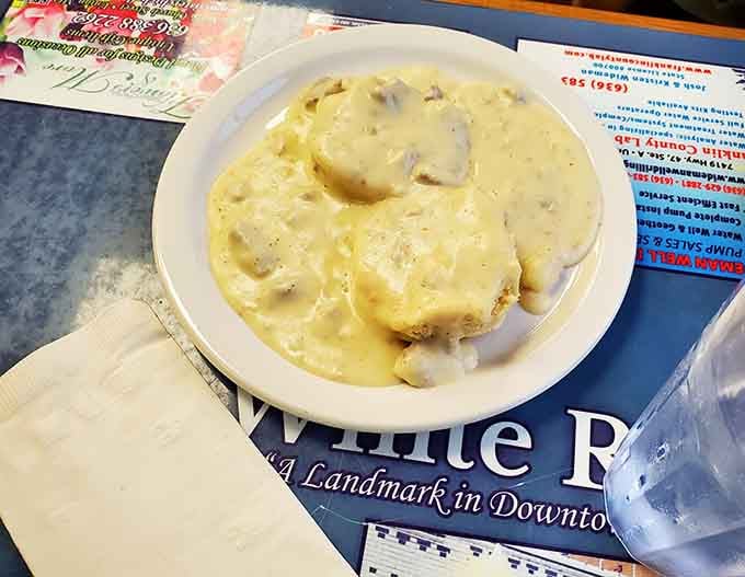 Biscuits completely surrendered to a thick, peppery gravy, and honestly, nobody's complaining about that outcome.