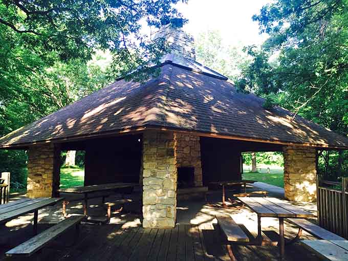 Stone pillars, a pitched roof, and dappled forest light &mdash; this picnic shelter has more character than most restaurants.