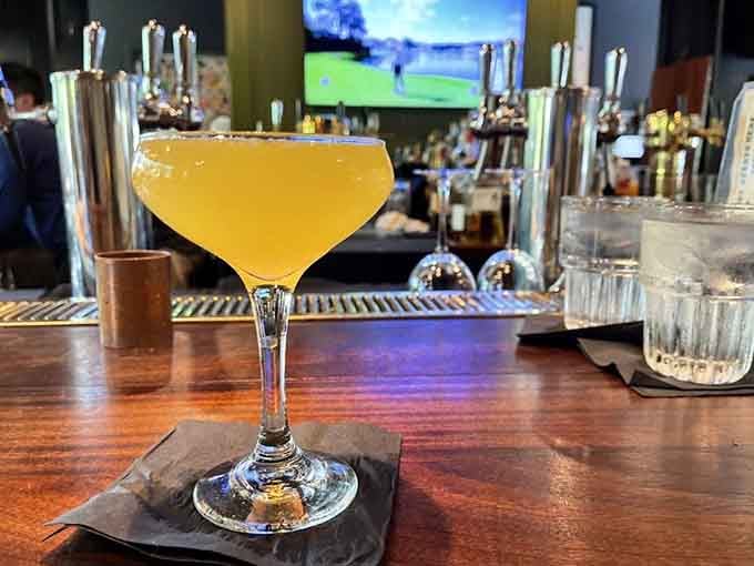 One golden cocktail in a coupe glass at Windsor's bar. Elegant, chilled, and clearly not messing around.