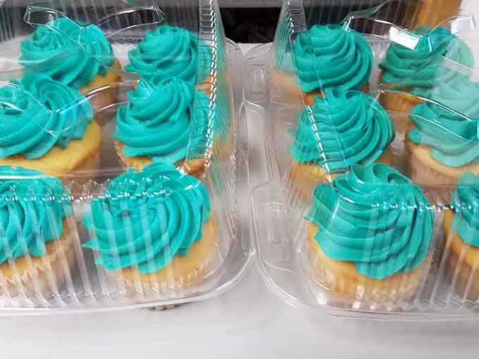 Bright teal frosting swirled high on golden cupcakes, cheerful enough to make even a Monday feel like a celebration.