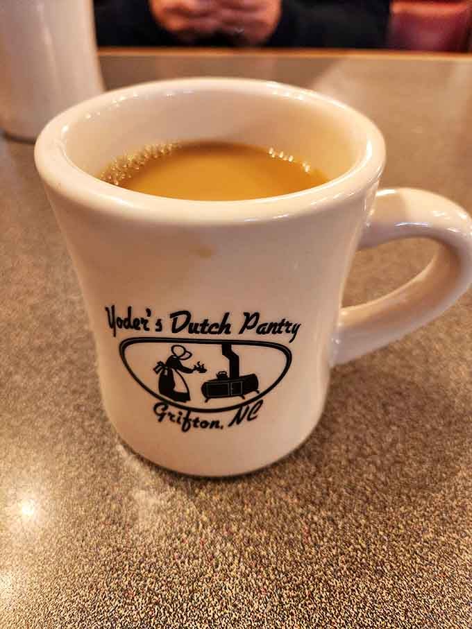 A simple cup of coffee served in a Yoder's mug, the kind of detail that tells you this place takes pride in everything.