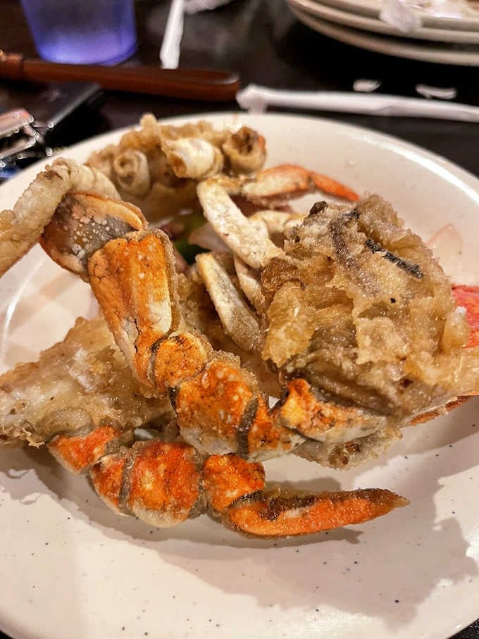 Fried crab, golden and crispy, sitting on a plate like it owns the place. Because it does.