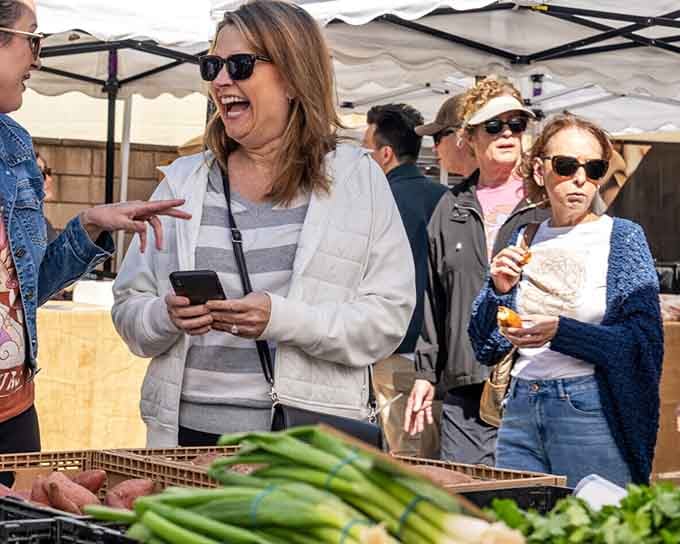 Pure, unfiltered joy at the local farmers market. This is what happens when a community actually likes spending time together.