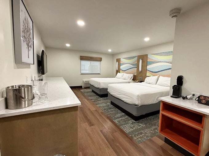 Two crisp beds, a colorful wave headboard, and a coffee maker, everything you need to recharge before round two on the slides.