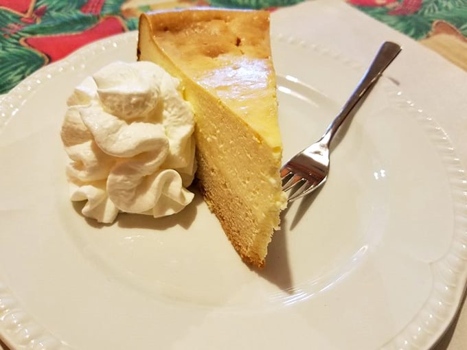 A golden slice of homemade cheesecake with a dollop of whipped cream, dessert this good deserves its own round of applause.
