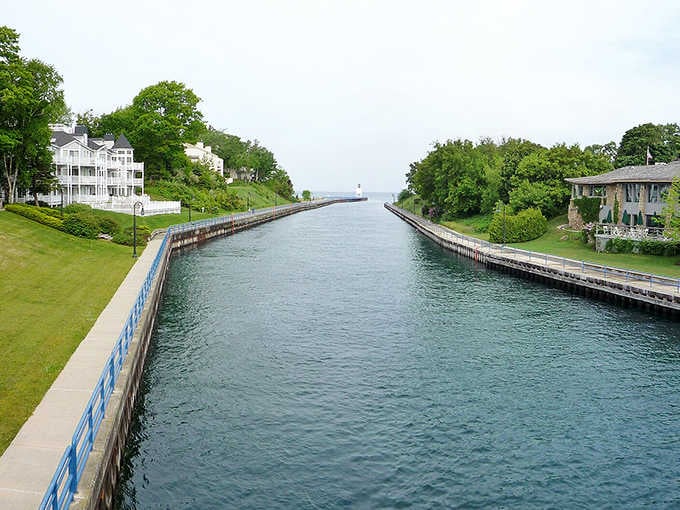 Charlevoix's Pine River Channel stretches toward Lake Michigan like a runway, with elegant homes lining both sides in quiet splendor.