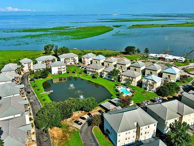Waterfront living meets lush green marshland in this stunning aerial view of Daphne's Mobile Bay community.