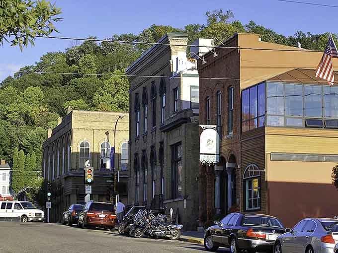 Hudson's downtown proves that good bones never go out of style, with historic brick buildings stretching toward tree-covered bluffs in the distance.
