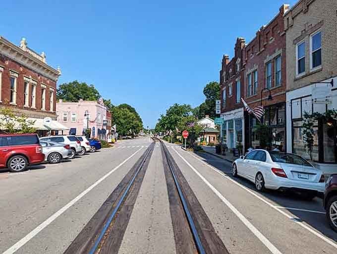 La Grange's sun-drenched main street with those gleaming rails running straight down the center is proof that some towns just do things their own way.