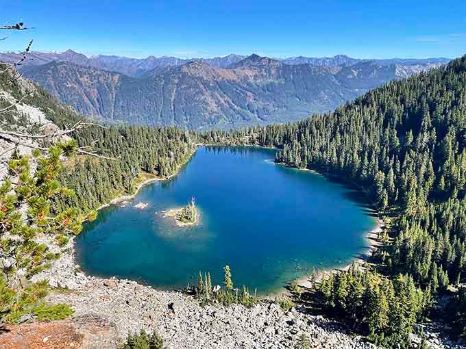 That tiny island floating in turquoise water looks like someone dropped a perfect emerald into nature's jewelry box.