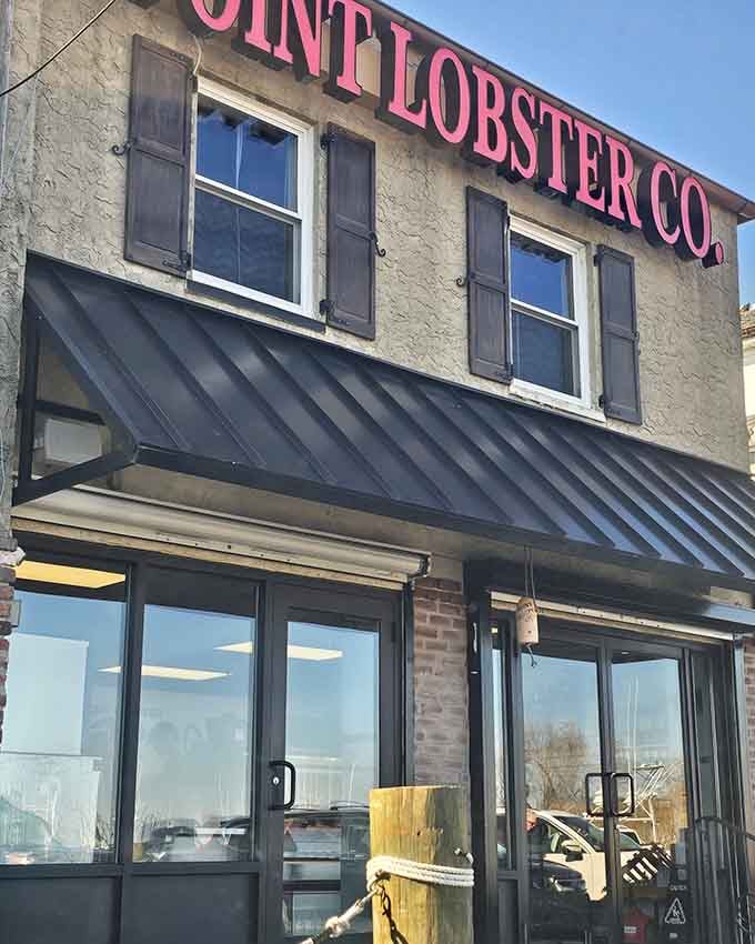 Those bold pink letters spelling out "Point Lobster Co." against a steel awning make a statement that's impossible to drive past without turning around.