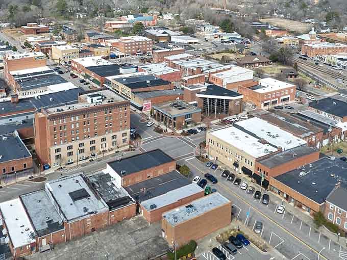 Tree-lined sidewalks and classic brick facades in the summer sun - Sanford's main street is an open invitation.