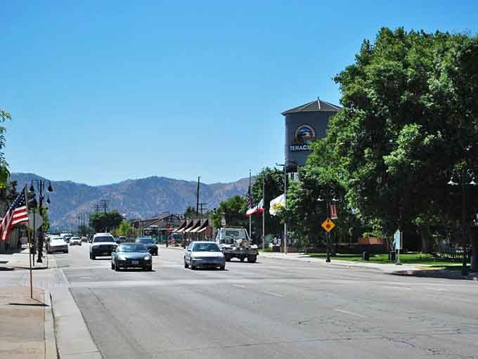 Tehachapi's iconic water tower stands tall above a tree-lined main street that feels genuinely proud of itself.