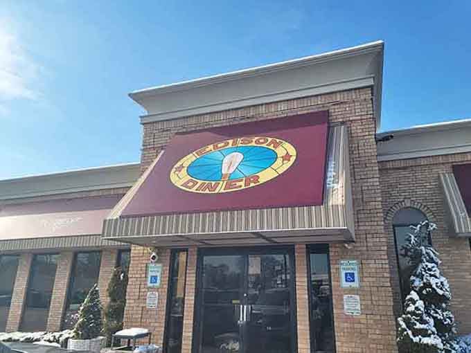That cheerful clock logo promises timely service and timeless comfort food in a bright, welcoming brick building.