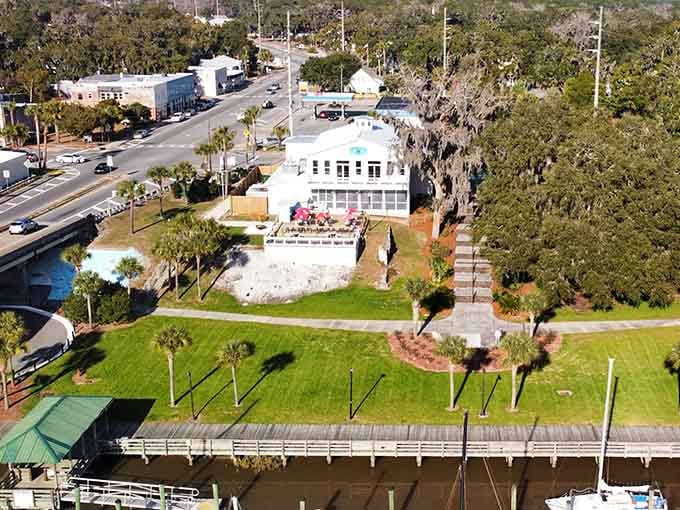 From above, Darien's waterfront tells the whole story, a marina, palm trees, and a white building that knows it has the best seat in town.