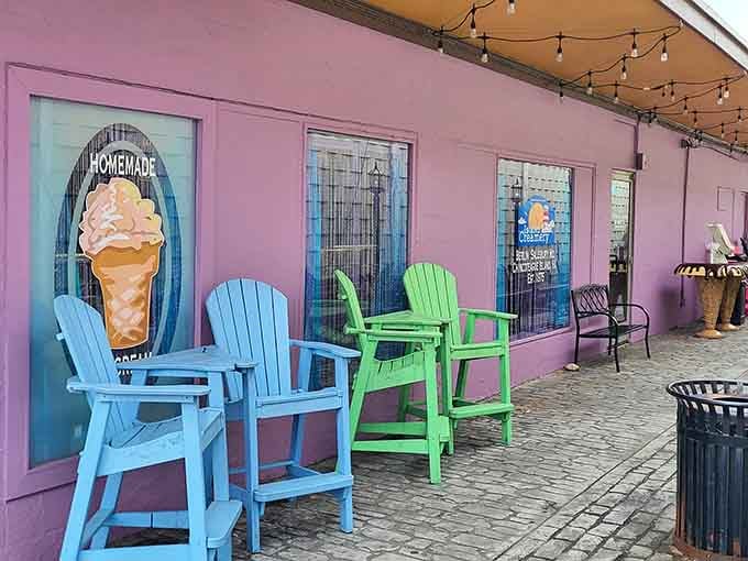 Blue and green Adirondack chairs lined up outside Island Creamery's pink walls are basically shouting "sit down, relax, and enjoy every bite."