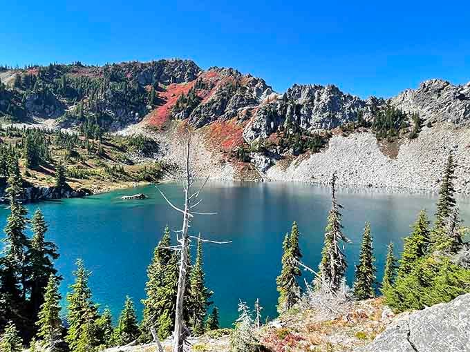 Autumn colors paint the rocky slopes surrounding this alpine gem in shades that would make any artist jealous.