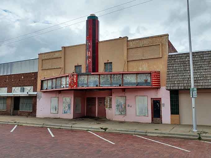 Faded pink walls and a peeling Art Deco marquee whisper of Saturday nights and popcorn dreams.