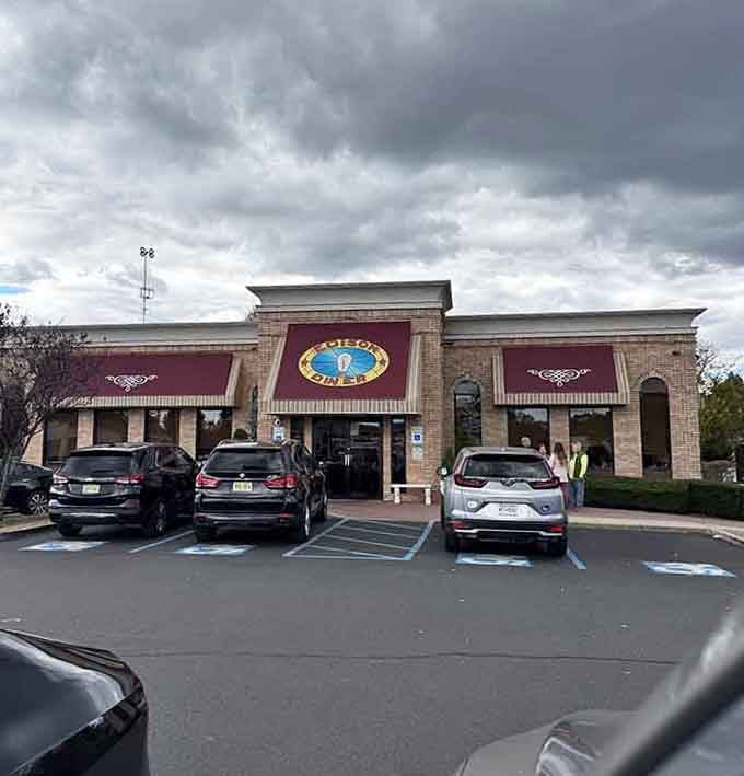 Storm clouds brewing overhead only make this inviting diner look more appealing as a warm refuge for hungry souls.