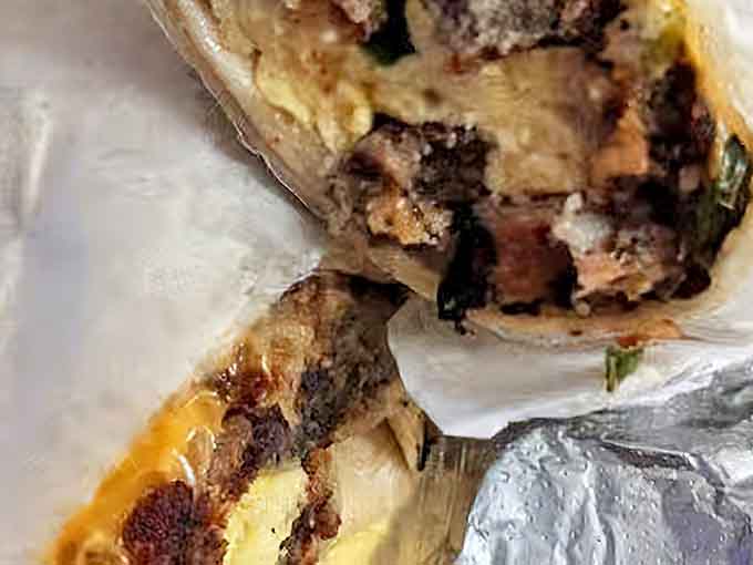 Packed with meat, egg, and melted cheese, this breakfast burrito means you won't be thinking about lunch anytime soon.