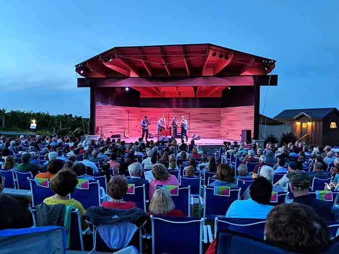 An outdoor amphitheater where wine and live music meet under the stars—someone understood the assignment perfectly.