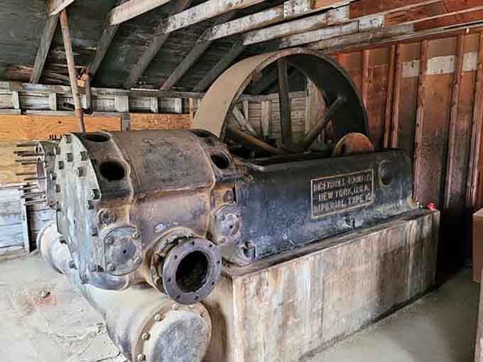 This vintage air compressor powered the whole operation once. Industrial muscle from an era that didn't mess around.