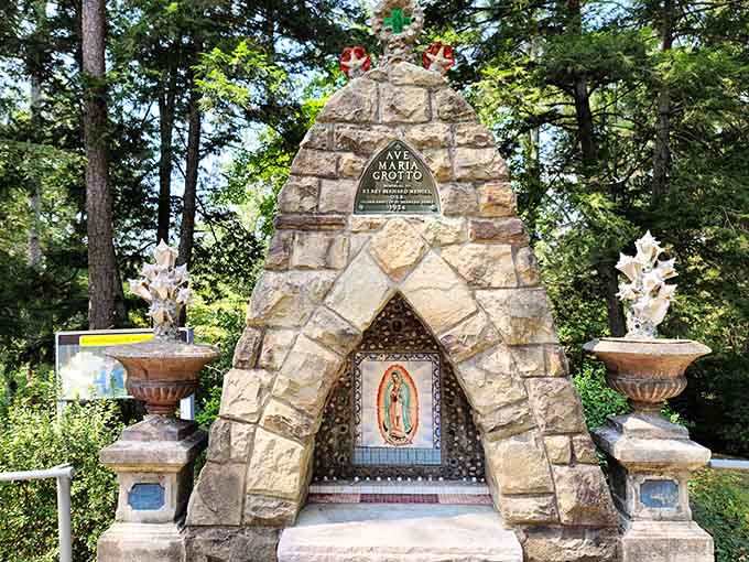Nestled among towering trees, the Ave Maria Grotto offers a peaceful setting for reflection, history, and quiet appreciation.