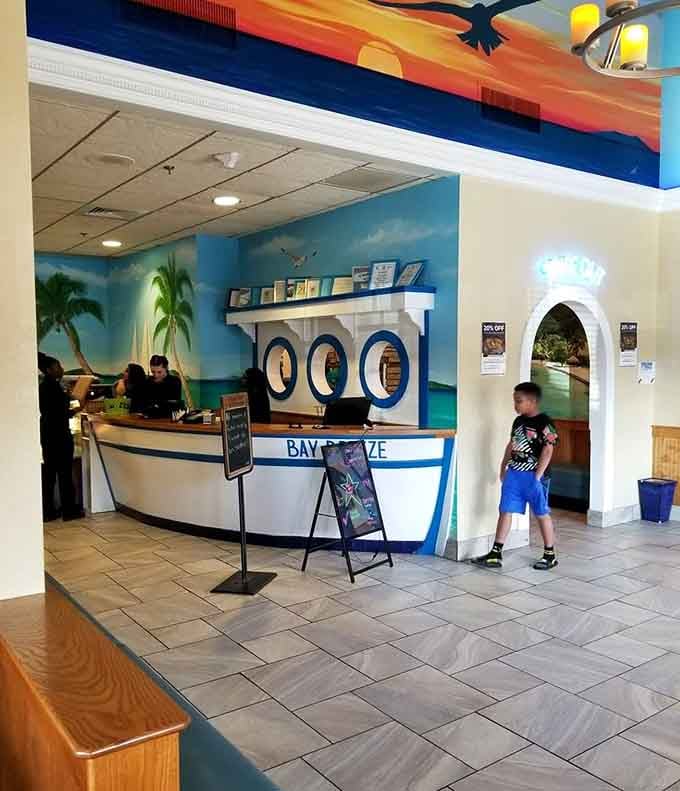 That boat-shaped front counter sets the tone immediately. You're not just eating dinner, you're boarding something special.